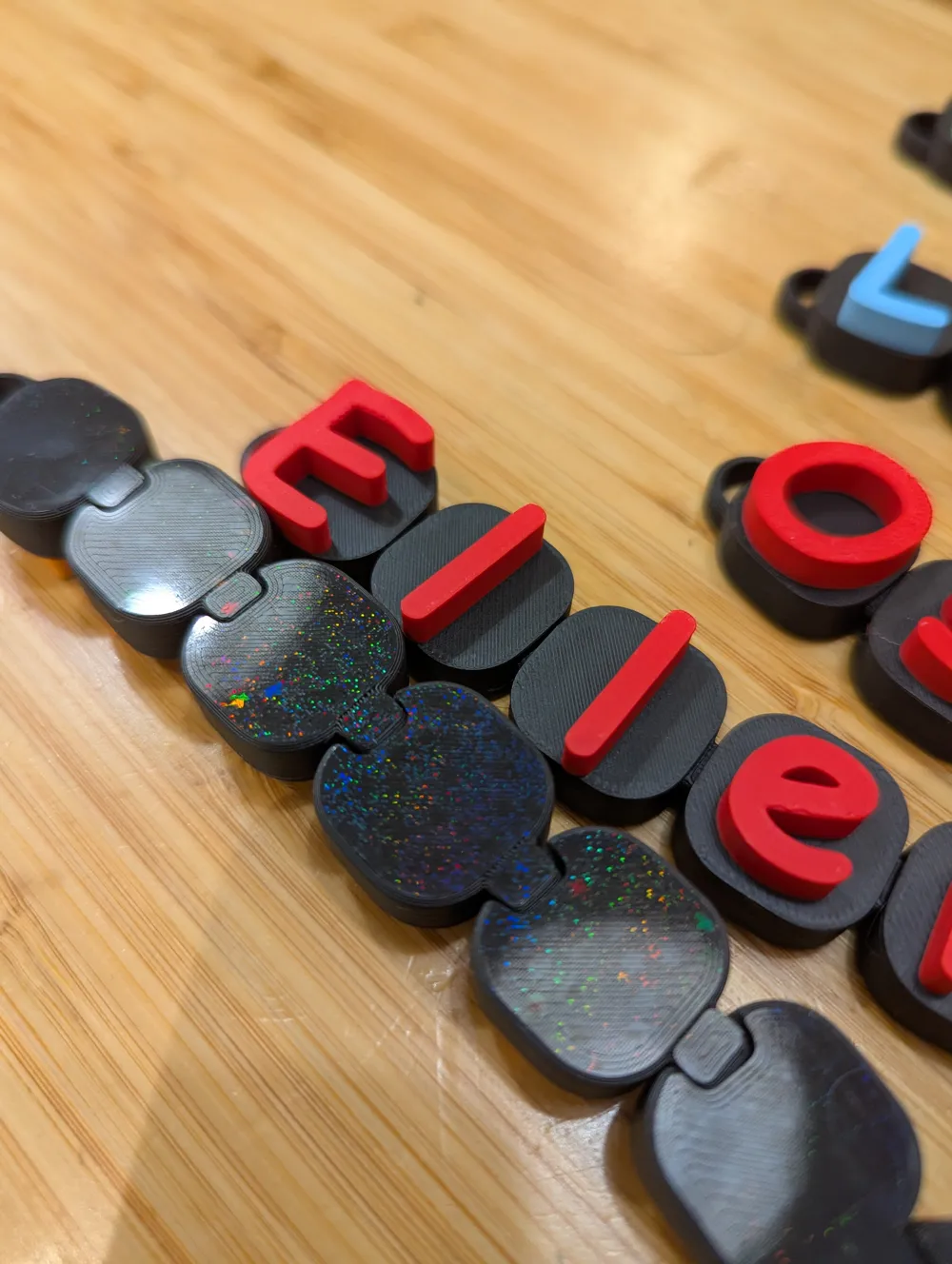 Flexi Name Keyring - Free 3D Print Model - MakerWorld
