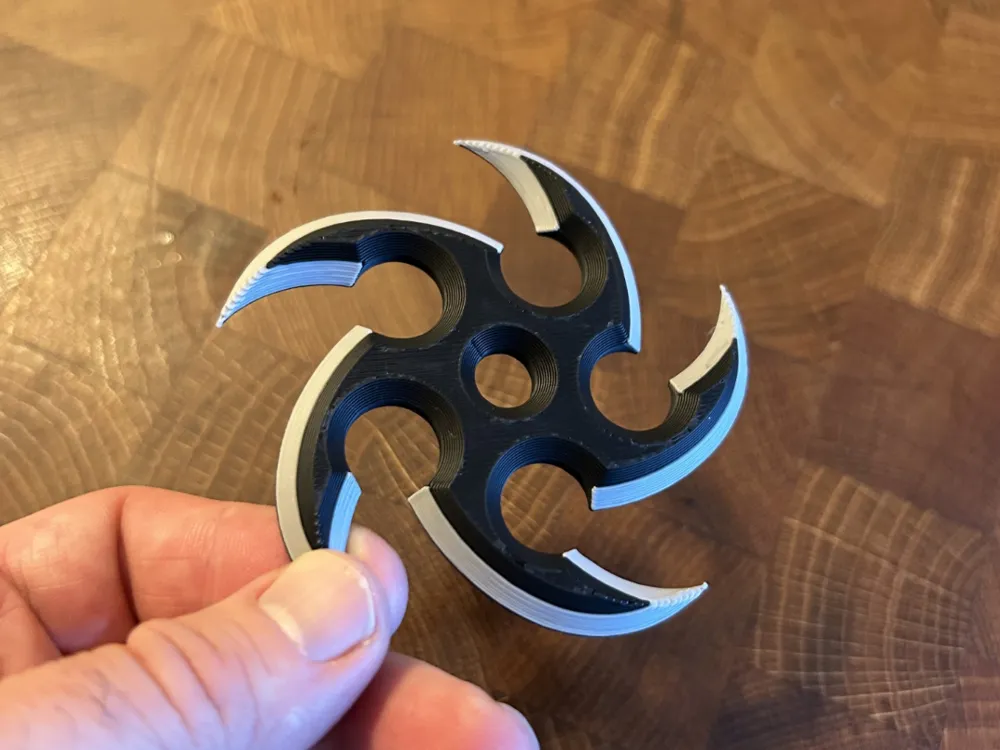 Spiral Shuriken / Throwing star by hanky MakerWorld: Download Free 3D ...