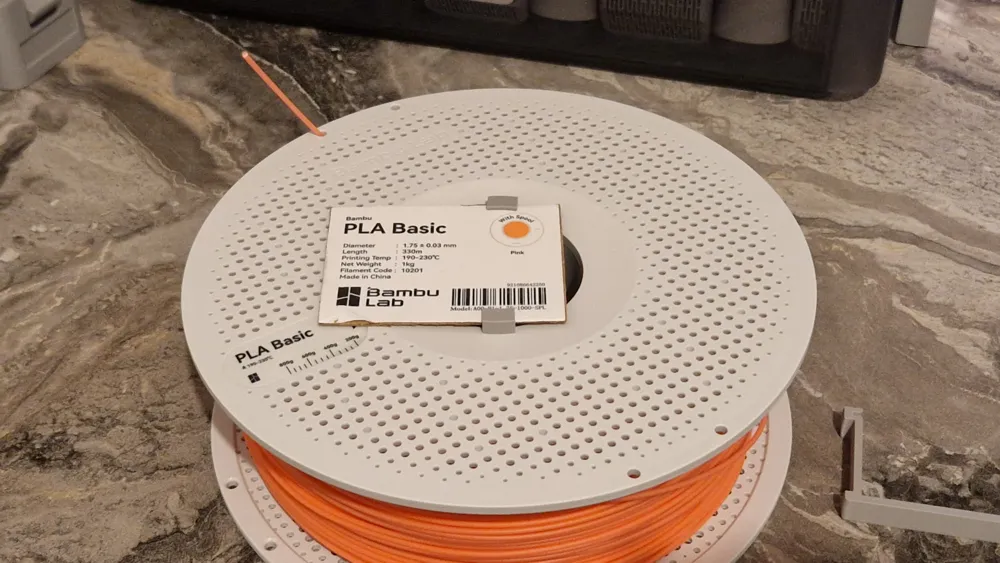 Filament label holder on the spool. by THEuda - MakerWorld