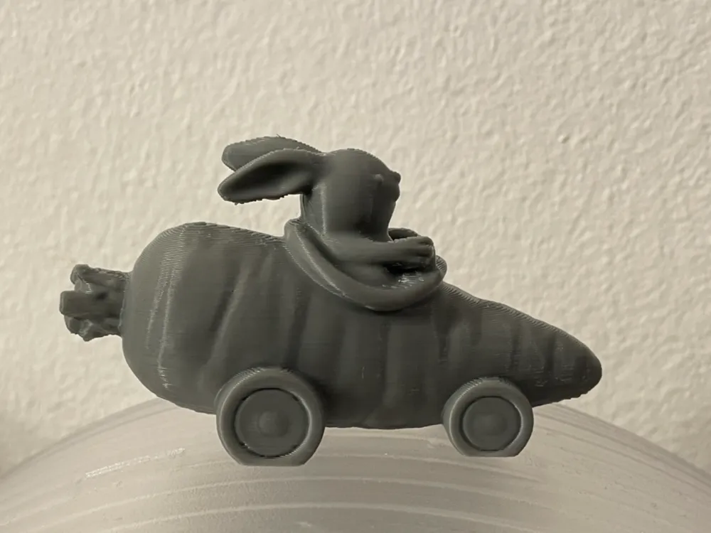 Cute easter Bunny Rabbit in carrot car sculpture / Süßer Oster hase im ...