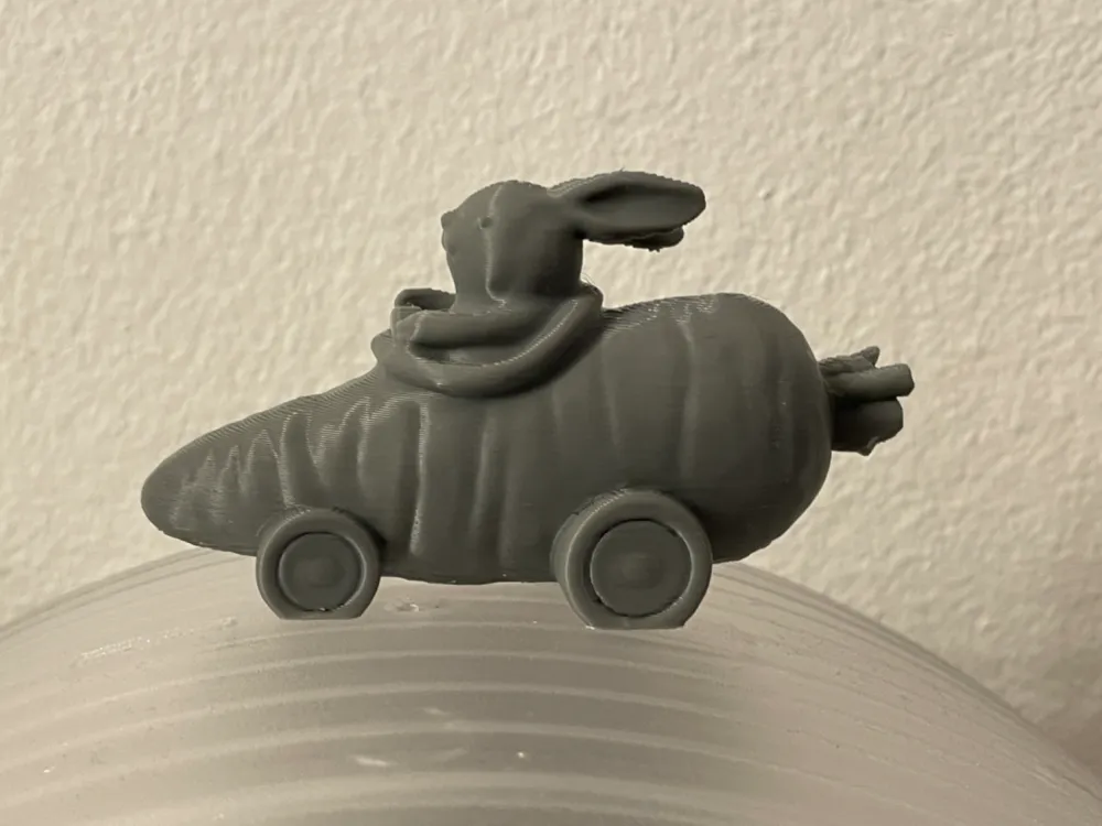 Cute easter Bunny Rabbit in carrot car sculpture / Süßer Oster hase im ...