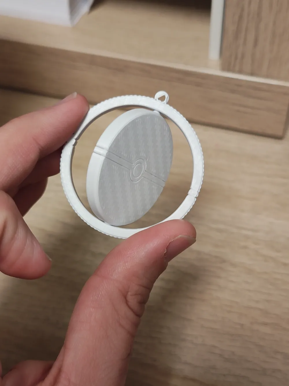 Spinning Pokeball Keyring Multicolor print in place by Herroc8 - MakerWorld