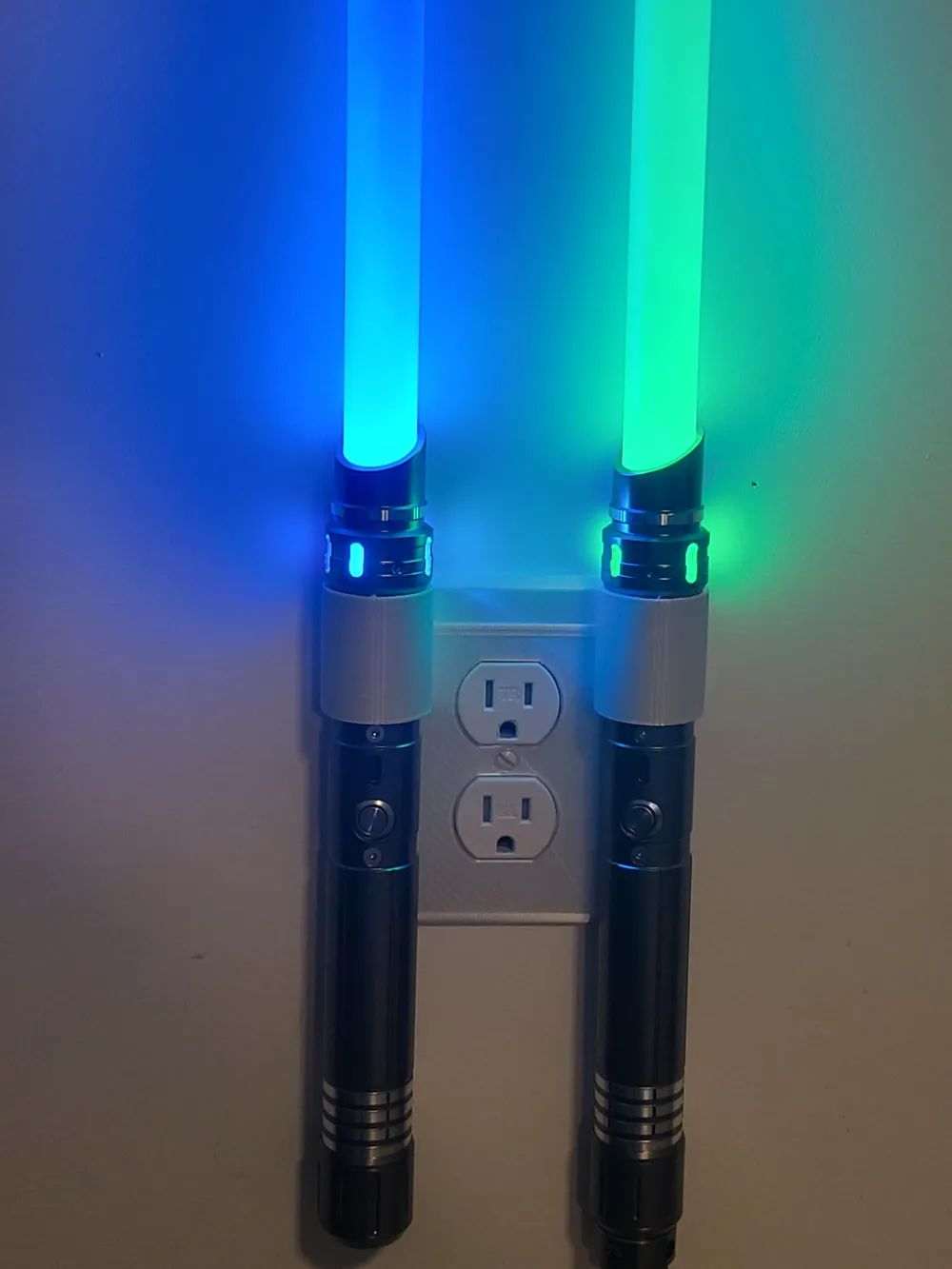 Light Sabre Holders using Wall Outlet by dehart007 - MakerWorld