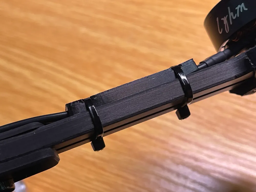 FPV drone motor wire protector, secured with 2mm zip ties, installable ...