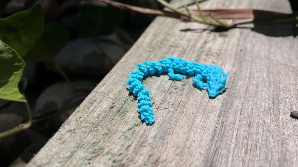 World's tiniest articulated dragon - Free 3D Print Model - MakerWorld