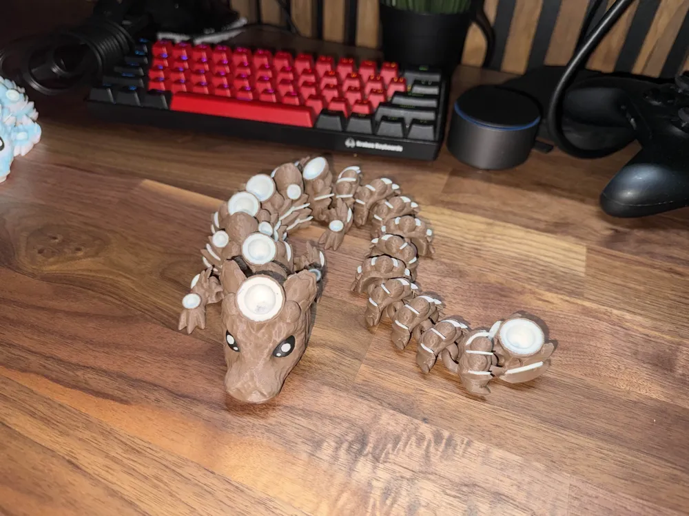 Coconut Articulated Dragon - By Vixvvo3D - Free 3D Print Model - MakerWorld