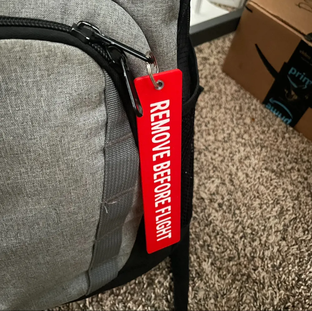 REMOVE BEFORE FLIGHT tag keychain replica by Vega3Dprinting - MakerWorld