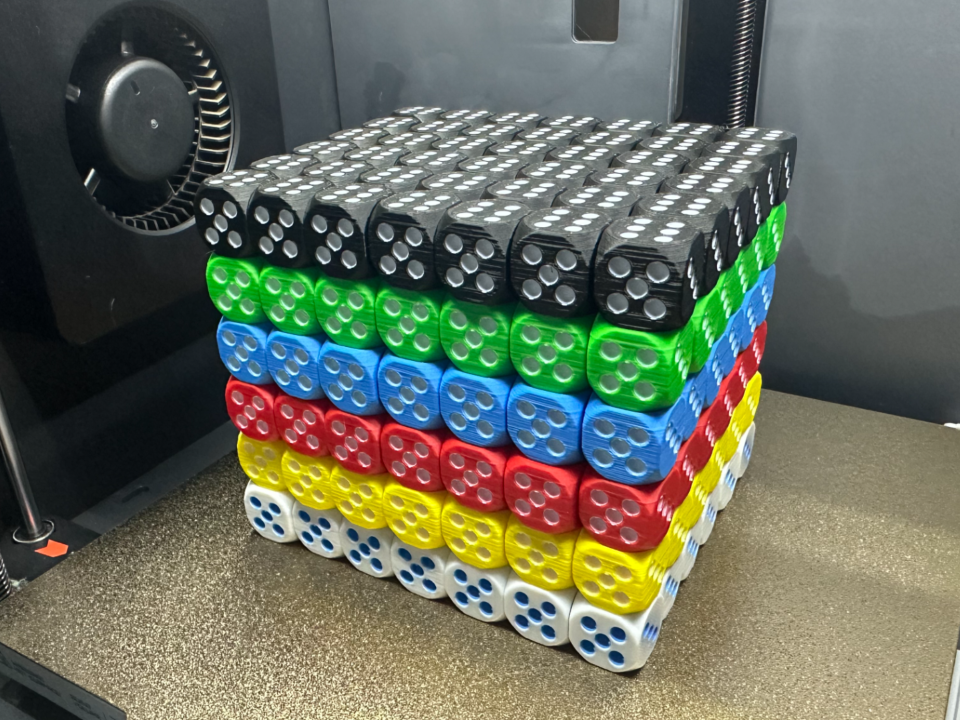 A collection of dice presented in an array of colors each piece ...