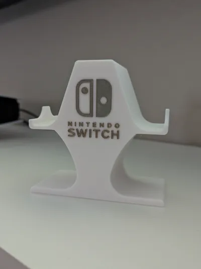 Nintendo Switch controller stand with logo Remixed by Joosdt - MakerWorld
