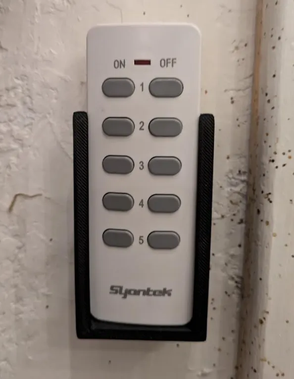 Remote Buddy: Wall-Mounted Remote Holder by PrintedPixels - MakerWorld