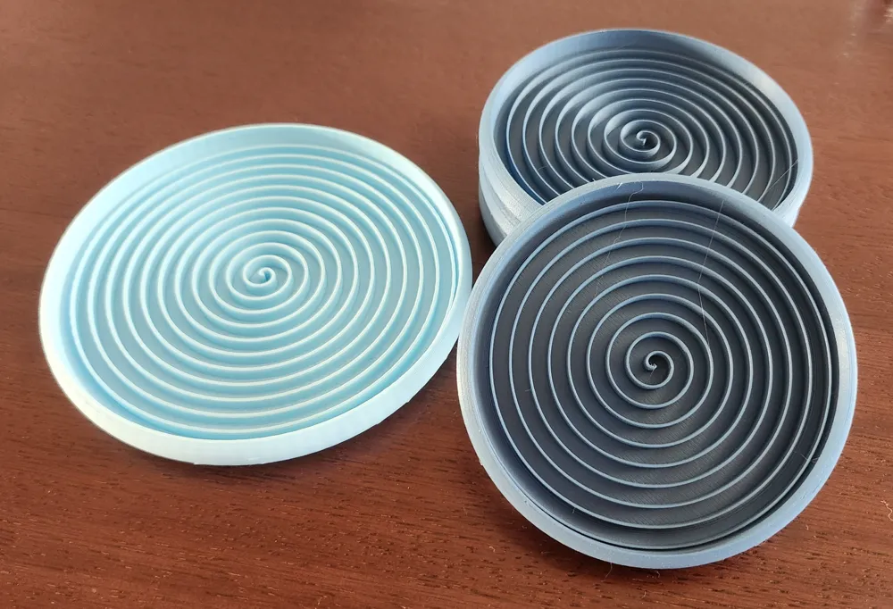 Stackable spiral coasters for glasses Remixed by DP design - MakerWorld