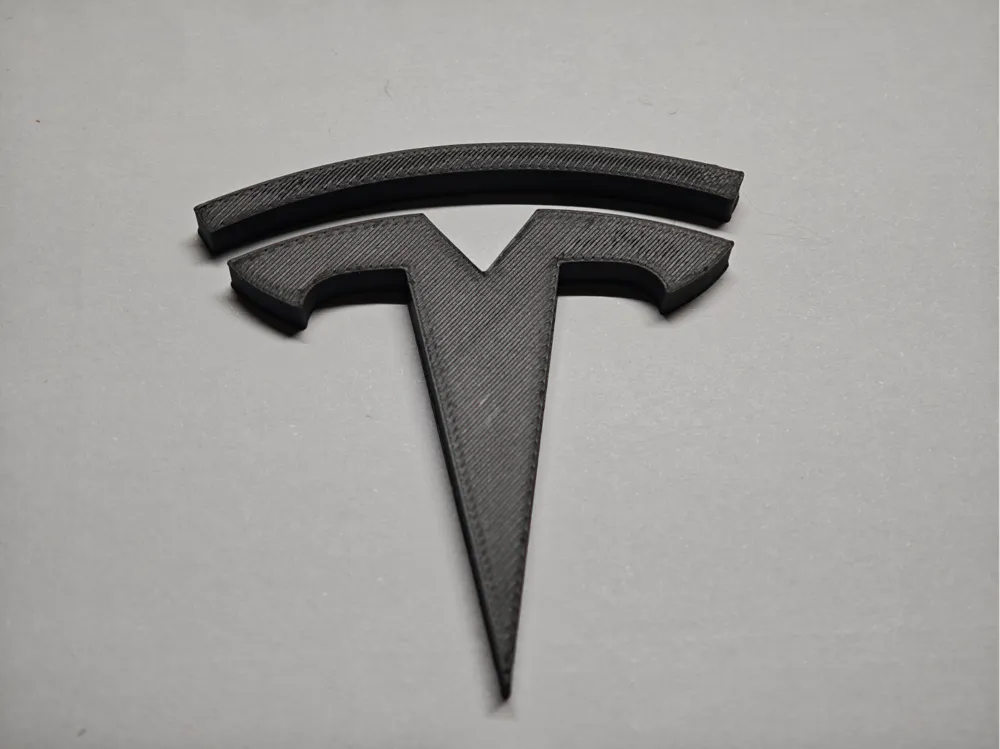 Tesla car logo/blackened logo and tesla lettering (also available in a ...