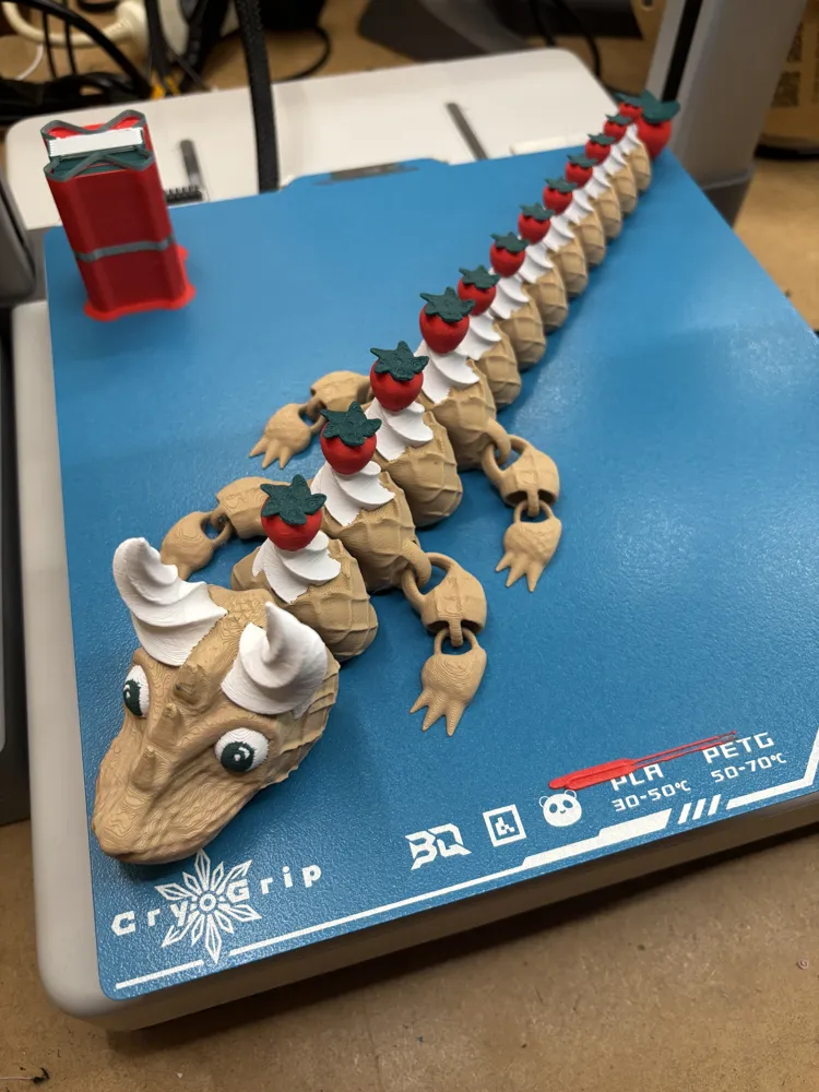 3D-printed Flexi Dragon: Strawberry Storm by MaxFabFlo MakerWorld: Download Free 3D Models