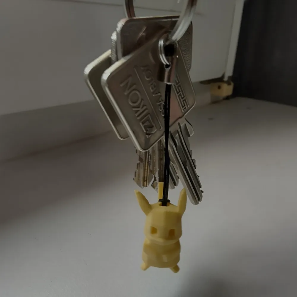 Low-poly Pikachu keychain Remixed by select2start Print - MakerWorld