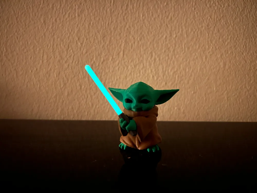 Baby Yoda with lightsaber by Ligurio - MakerWorld