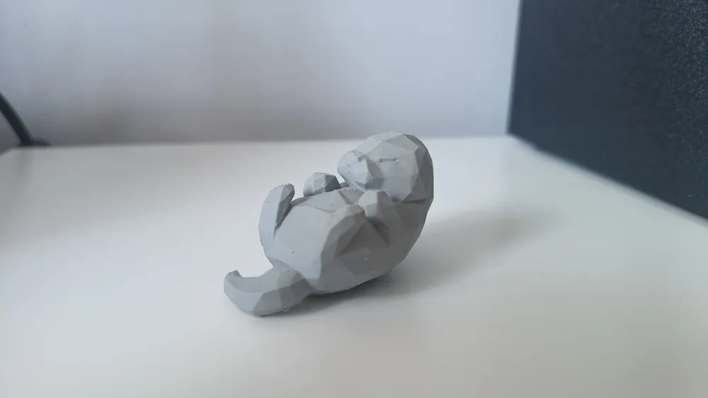Low Poly Sleeping Otter Figurine - Free 3D Print Model - MakerWorld