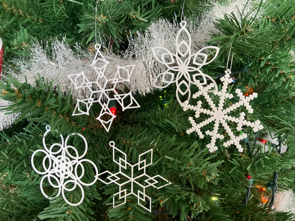 Various Geometric and Pixelated Snowflake Ornaments by PenolopyBulnick ...