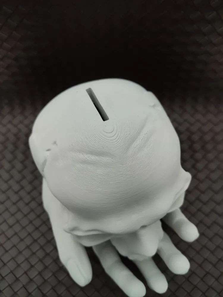 Skull in Hand - Coin bank / Piggy bank by RUMcajz MakerWorld: Download ...