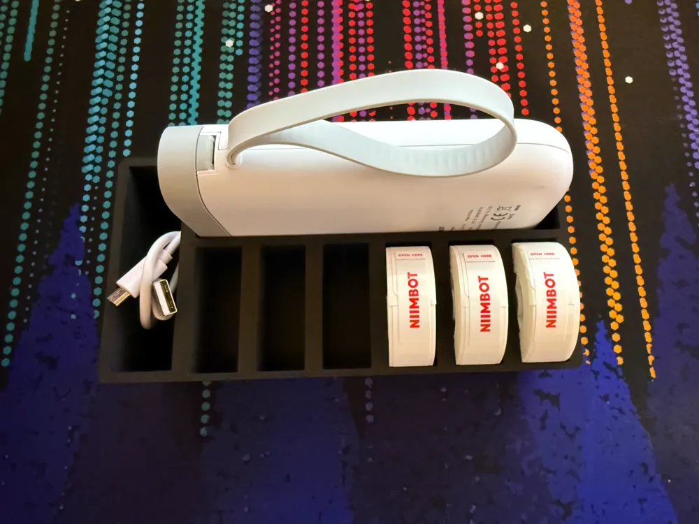 Gridfinity NIIMBOT D11 and Tape Holder by Hopper_Dropper - MakerWorld