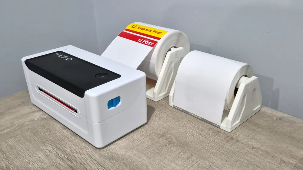 HERO PRINTER LABEL ROLL HOLDER (2 sizes) by Dean_Menhennet - MakerWorld