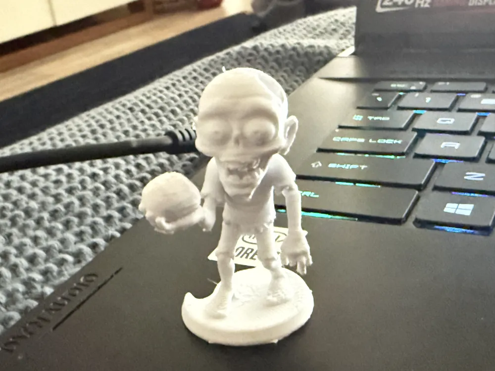 Cartoon Zombie Figurine – Brain in Hand by zerocool MakerWorld: Download Free 3D Models