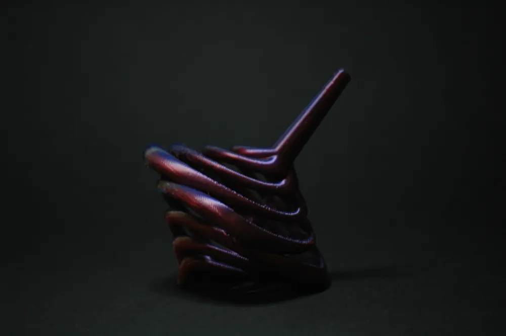 Helix petal spinning top - Free 3D Print Model - MakerWorld