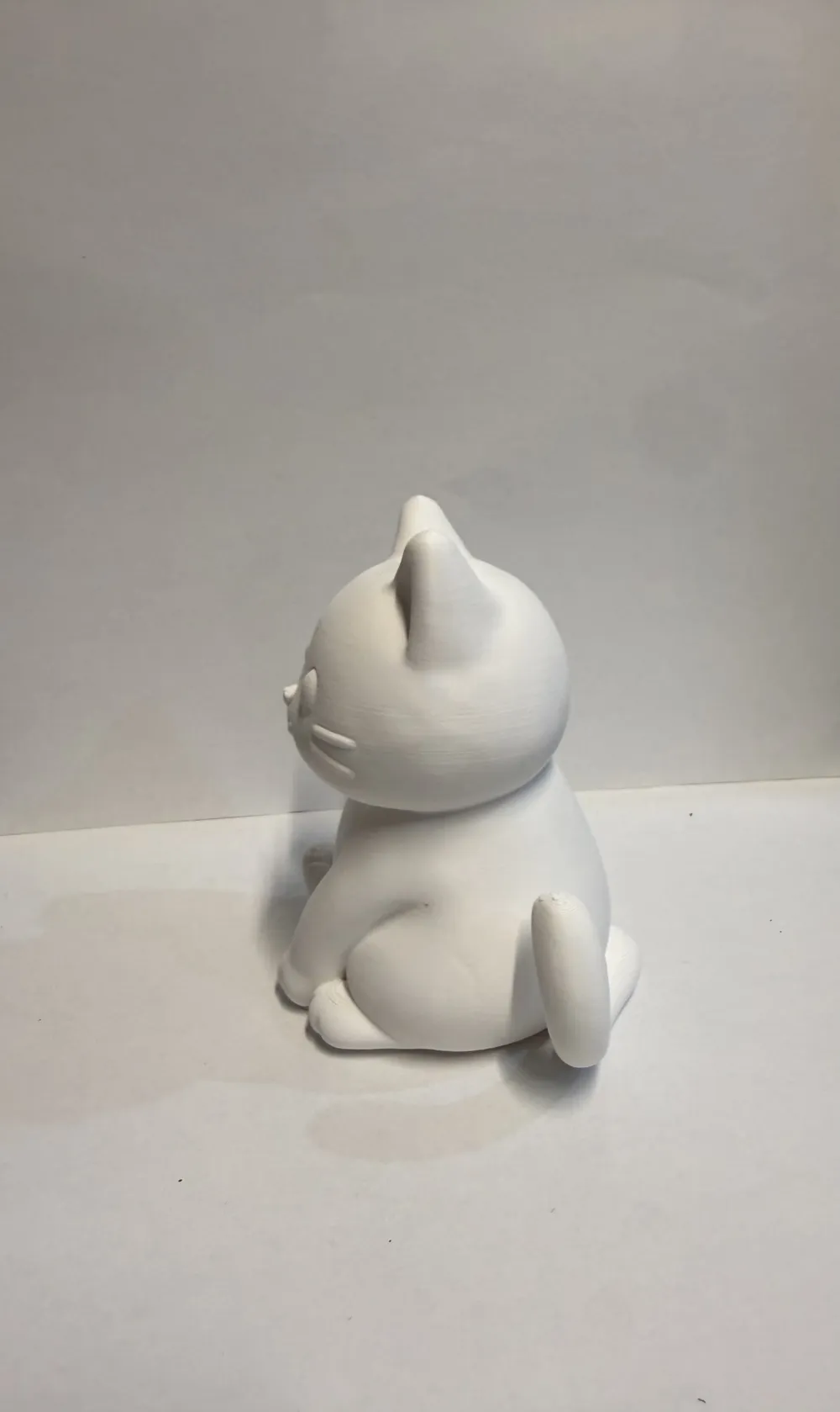 Tiny waving Cat Figurine by Tiki.Taki. MakerWorld: Download Free 3D Models