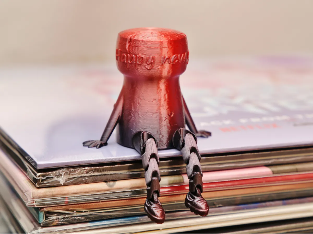 Champagne cork with articulated legs - Free 3D Print Model - MakerWorld