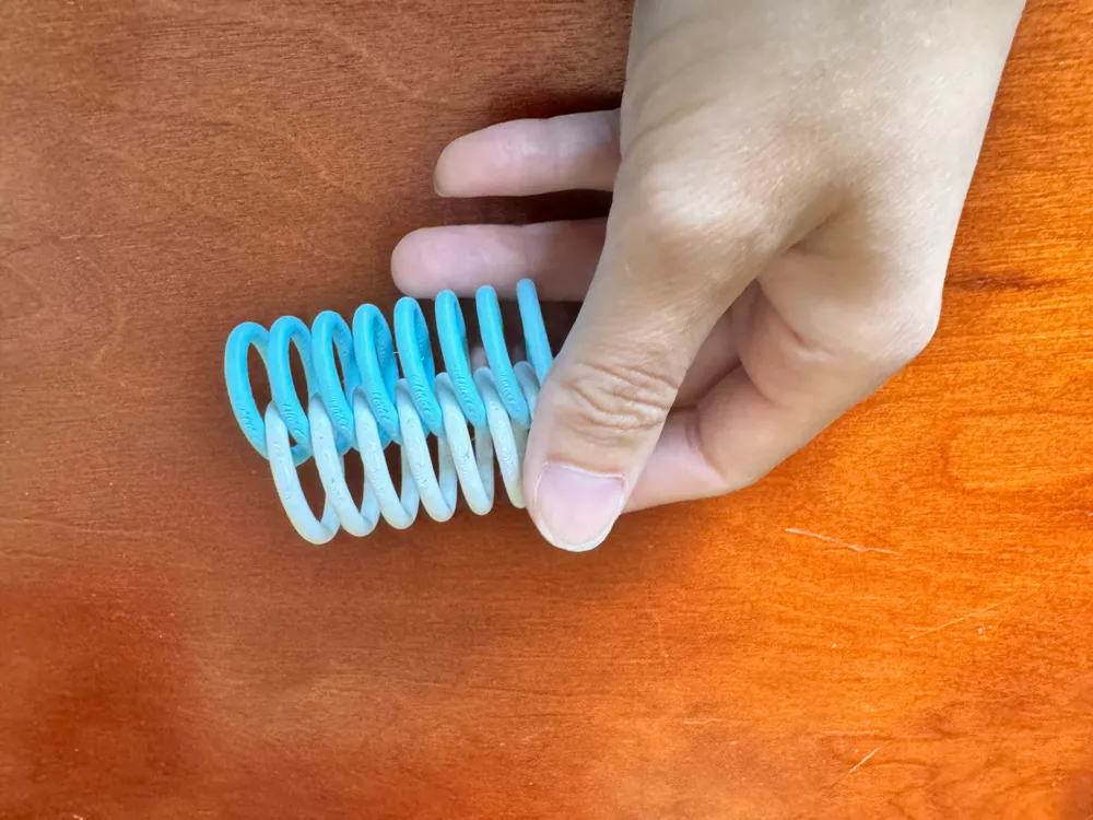Bouncy Cat Spring Toy - Free 3D Print Model - MakerWorld