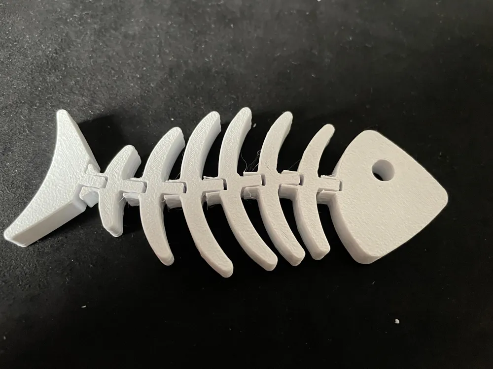 Flexi Fish skeleton articulated fidget! - Free 3D Print Model - MakerWorld