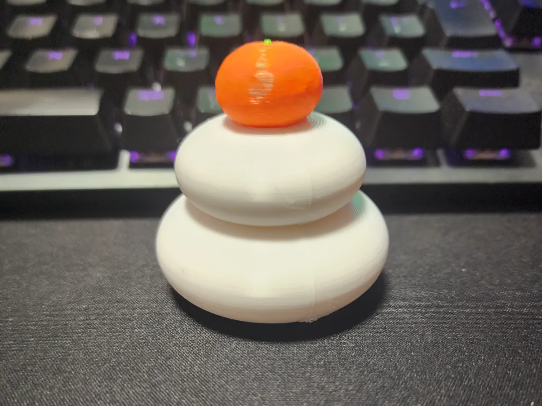 stacked rice cakes with an orange on top japan by 道楽 MakerWorld: Download Free 3D Models