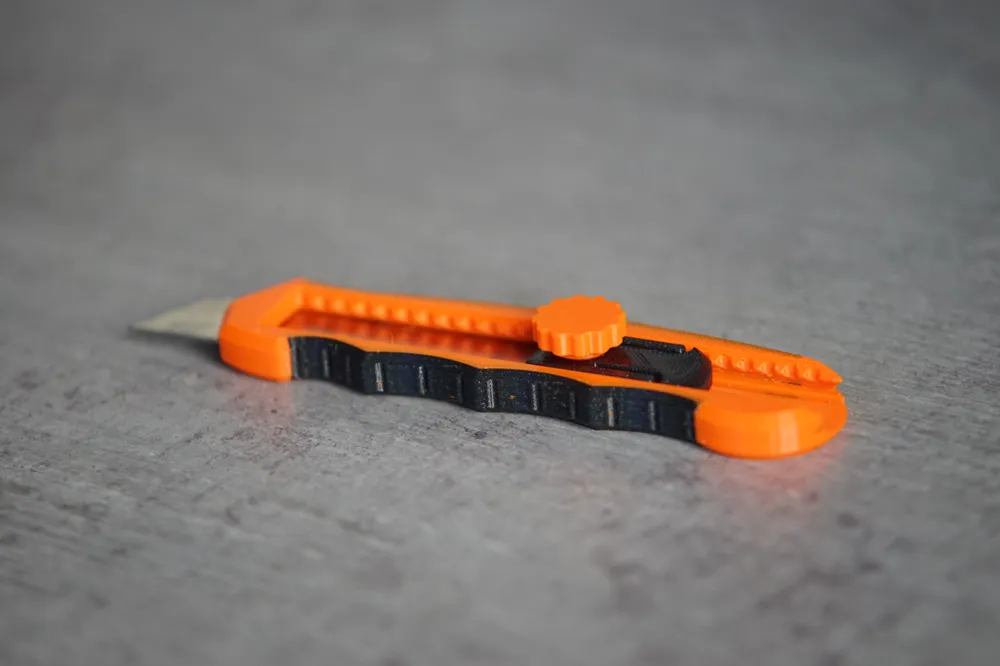 Ergonomic Box Cutter with Click Mechanism by ngprint - MakerWorld