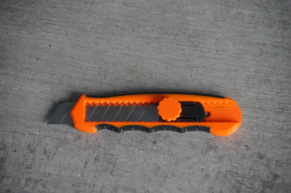 Ergonomic Box Cutter with Click Mechanism by ngprint - MakerWorld