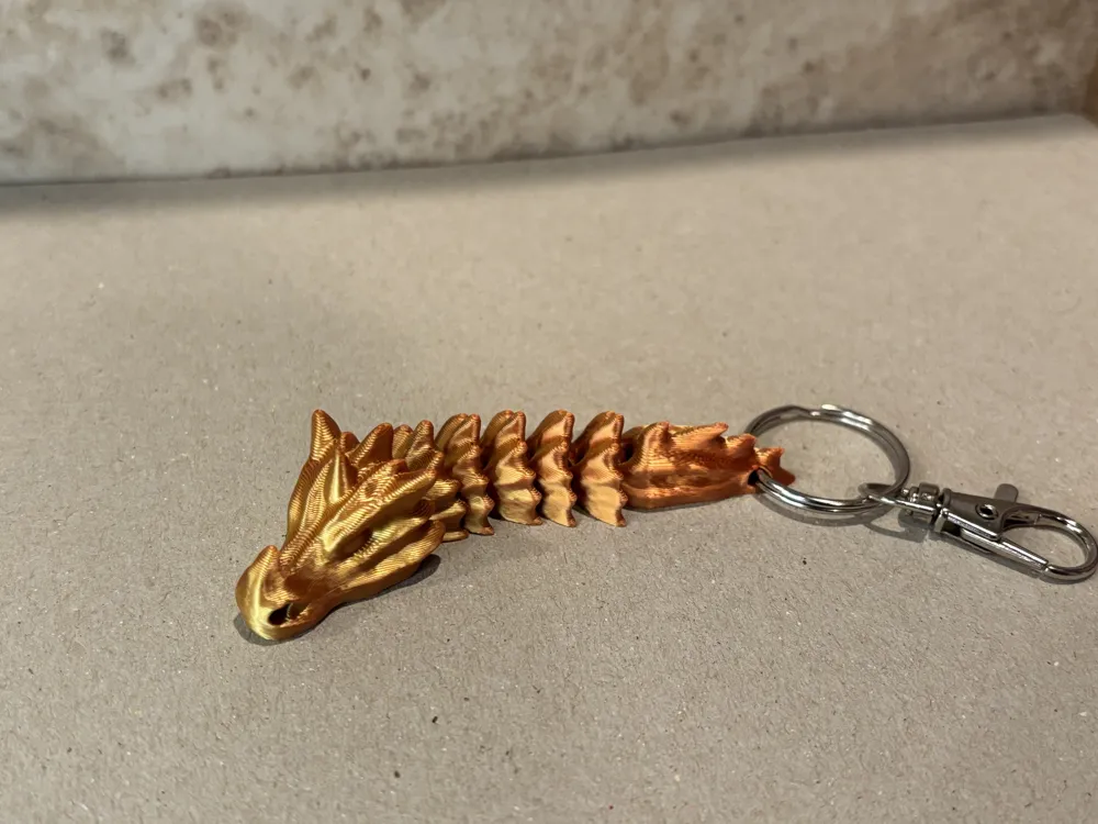 Dragon articulated Keychain - Free 3D Print Model - MakerWorld