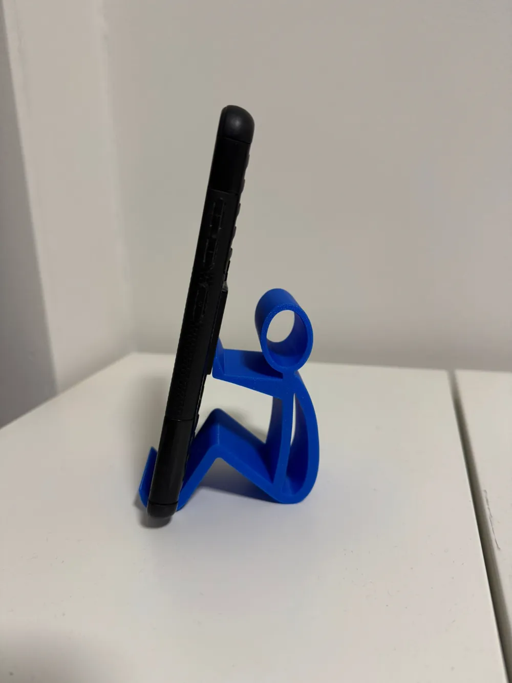Phone holder person sitting stand by Nerdherderz MakerWorld: Download ...