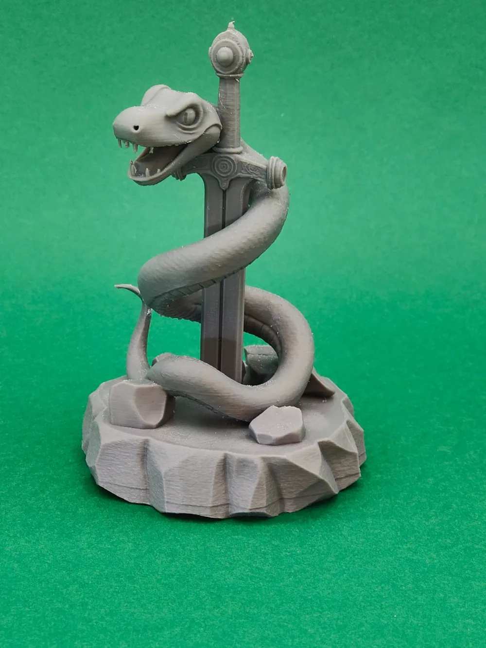 Snake around a Sword in the stone. - Free 3D Print Model - MakerWorld