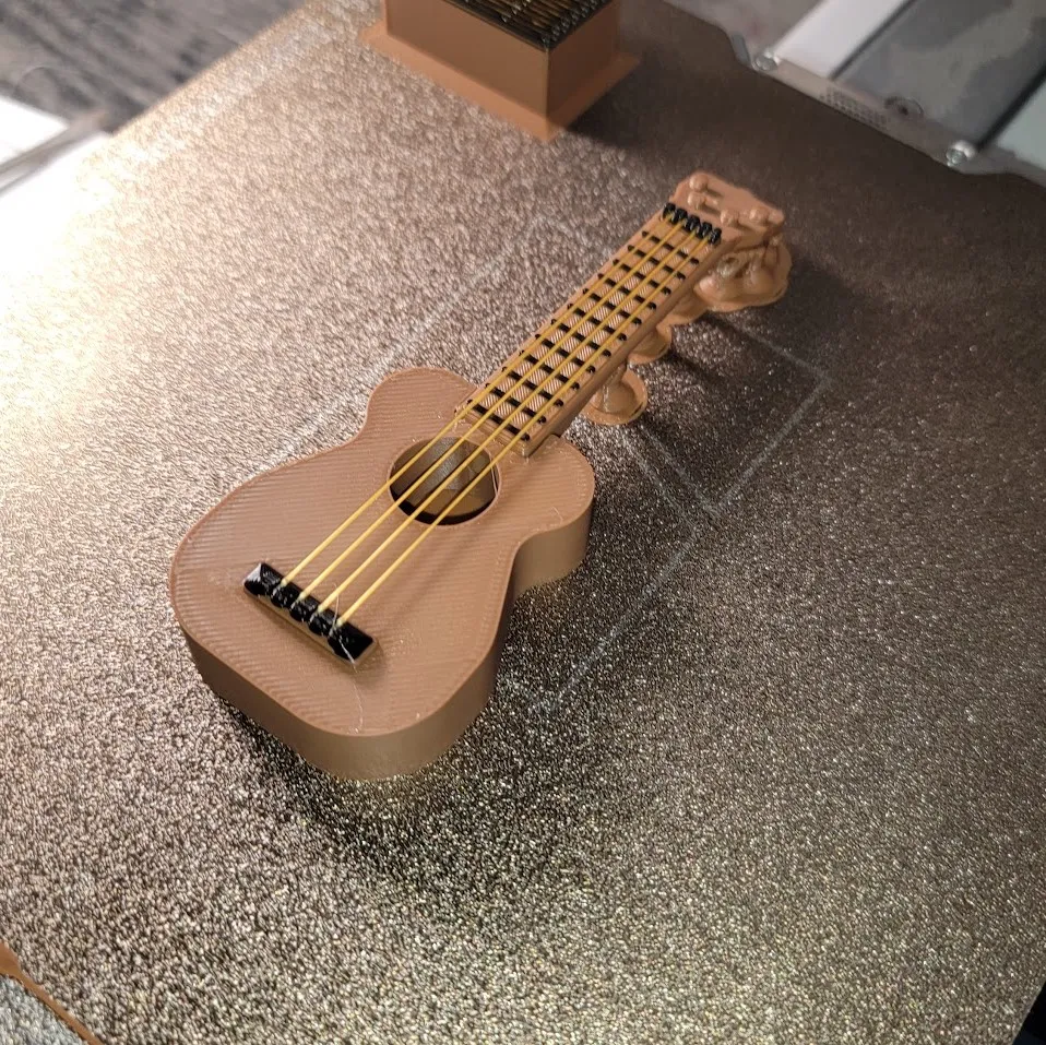Print in place Ukulele with strings by angrysquirrel - MakerWorld