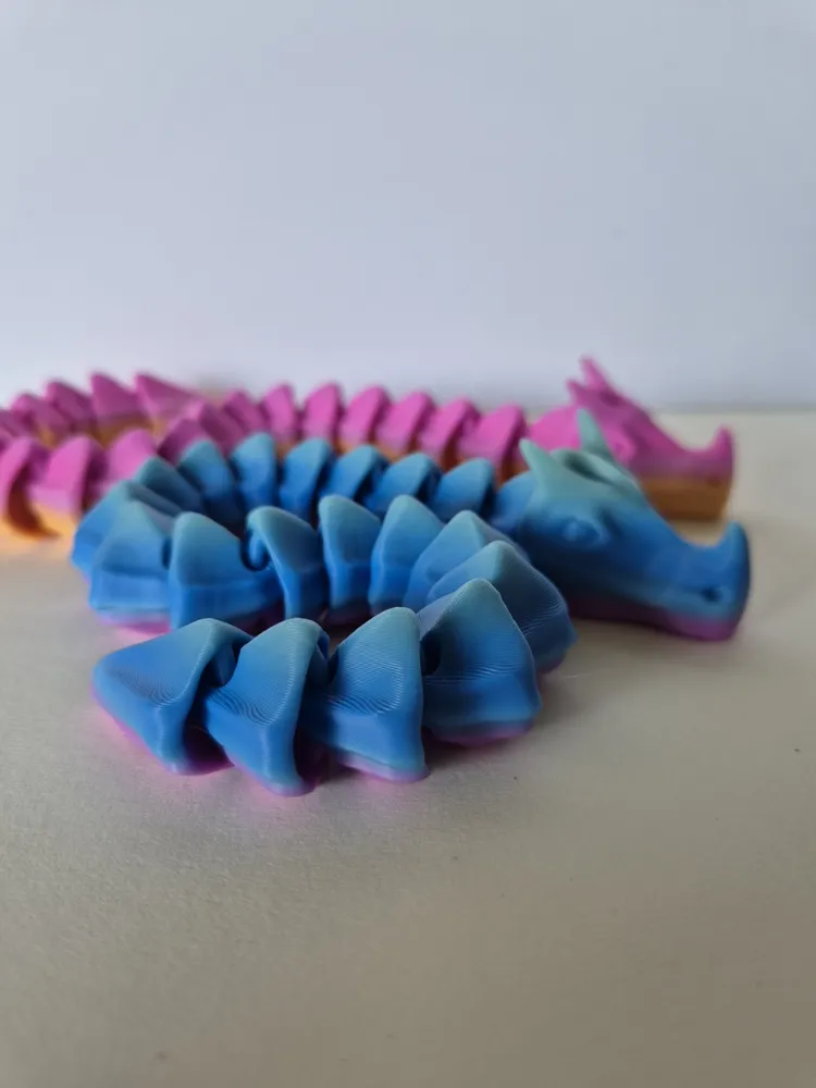 Dragón articulado liso por The Frenchie MakerWorld: Descarga Modelos 3D ...