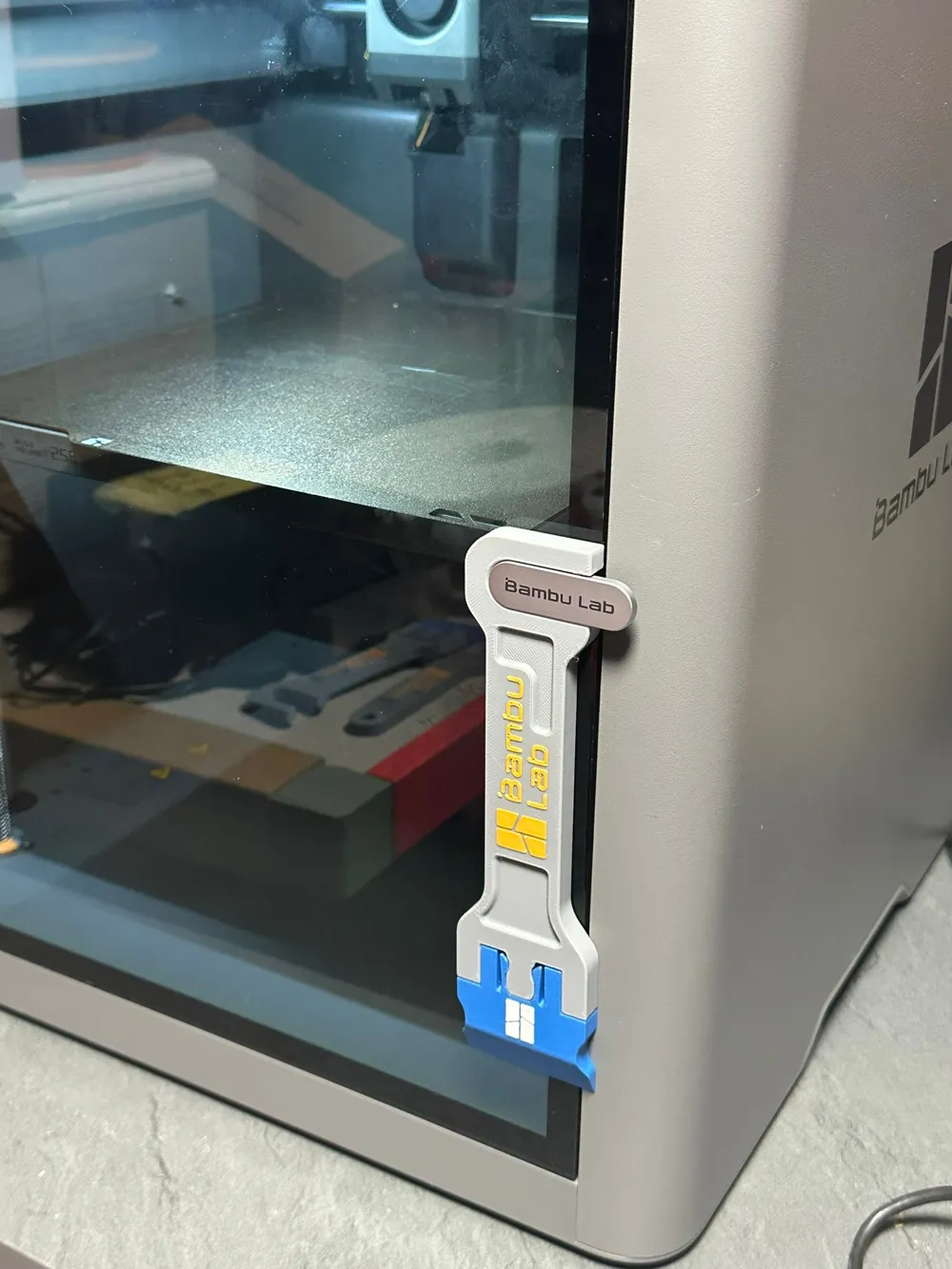 Bambu Lab P2S Door-Mounted Bed Scraper - Free 3D Print Model - MakerWorld