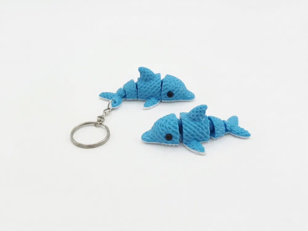 Mini knitted flexi dolphin + keychain - Free 3D Print Model - MakerWorld
