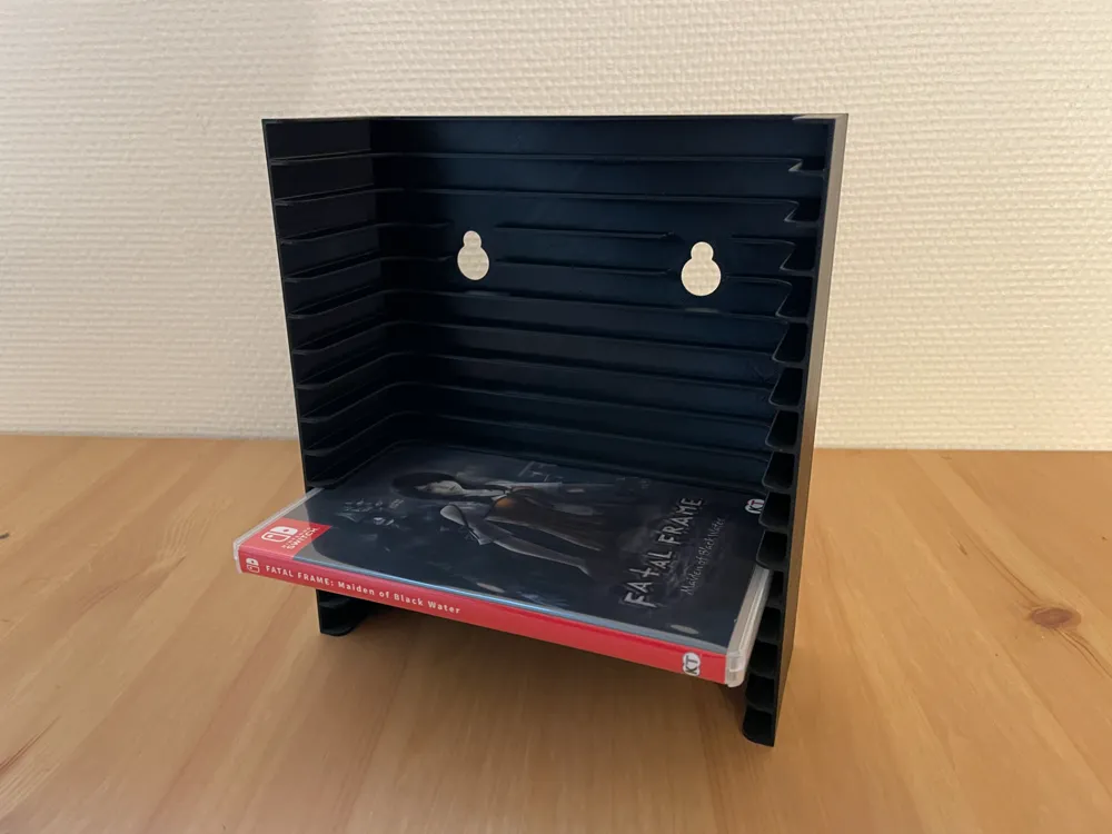 Nintendo Switch wall games holder by design3d - MakerWorld