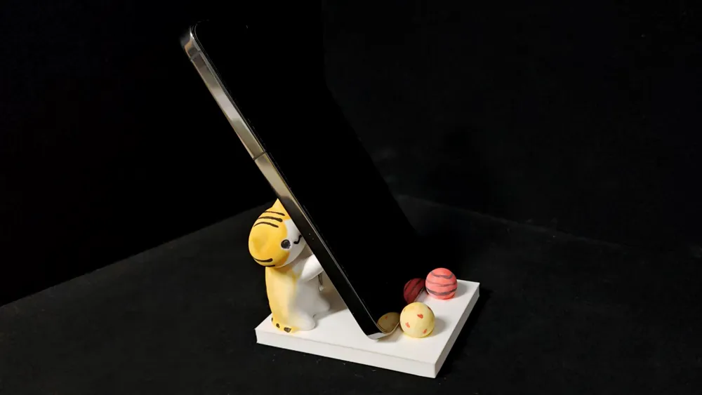 Whimsical Cat Phone Stand - Free 3D Print Model - MakerWorld
