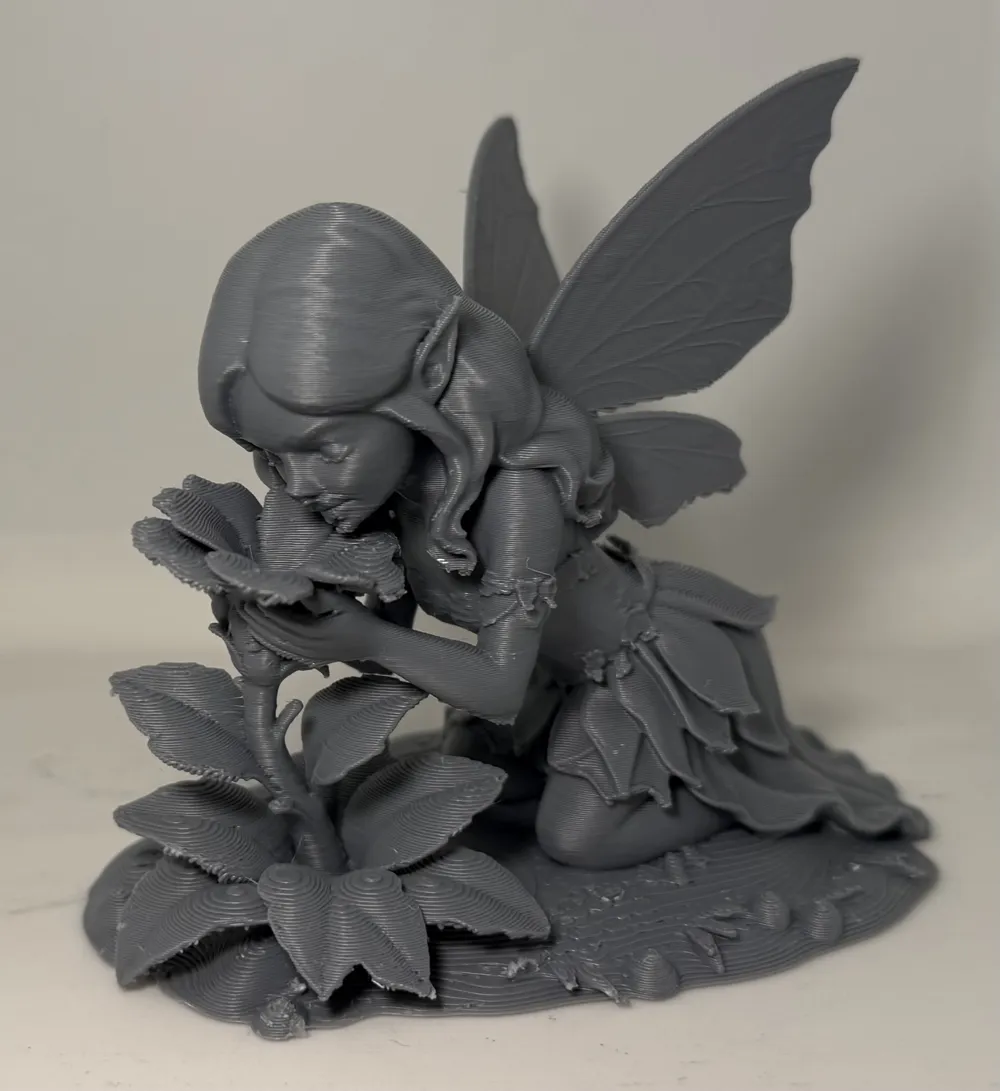 Garden Fairy Smelling a Flower - Free 3D Print Model - MakerWorld
