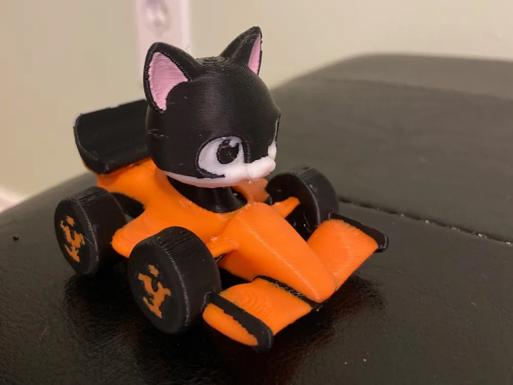 Cat driving Formula 1 McLaren car (Lando Norris) by Ryan_3D - MakerWorld