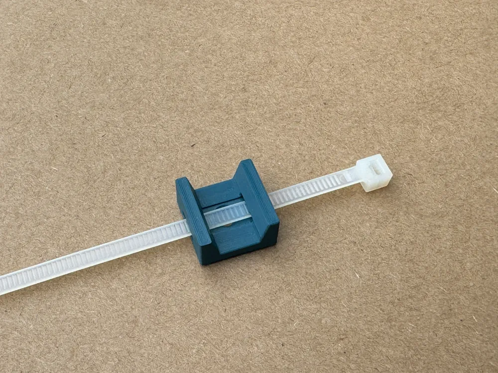 Wall holder for cable fixing with tie wrap hole by John Connor - MakerWorld