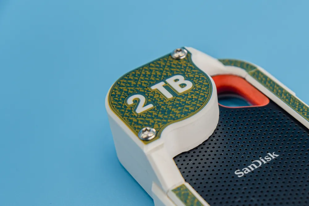 SanDisk Extreme SSD Enclosure with AirTag compartment by Jonas_H - MakerWorld