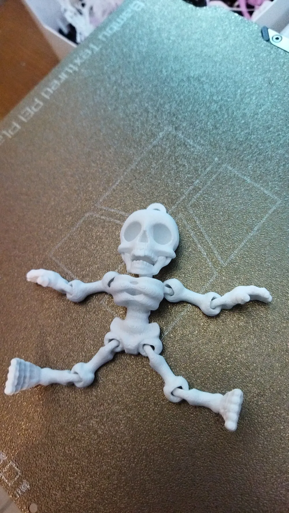 Flexi Skeleton Smile Keychain - Free 3D Print Model - MakerWorld