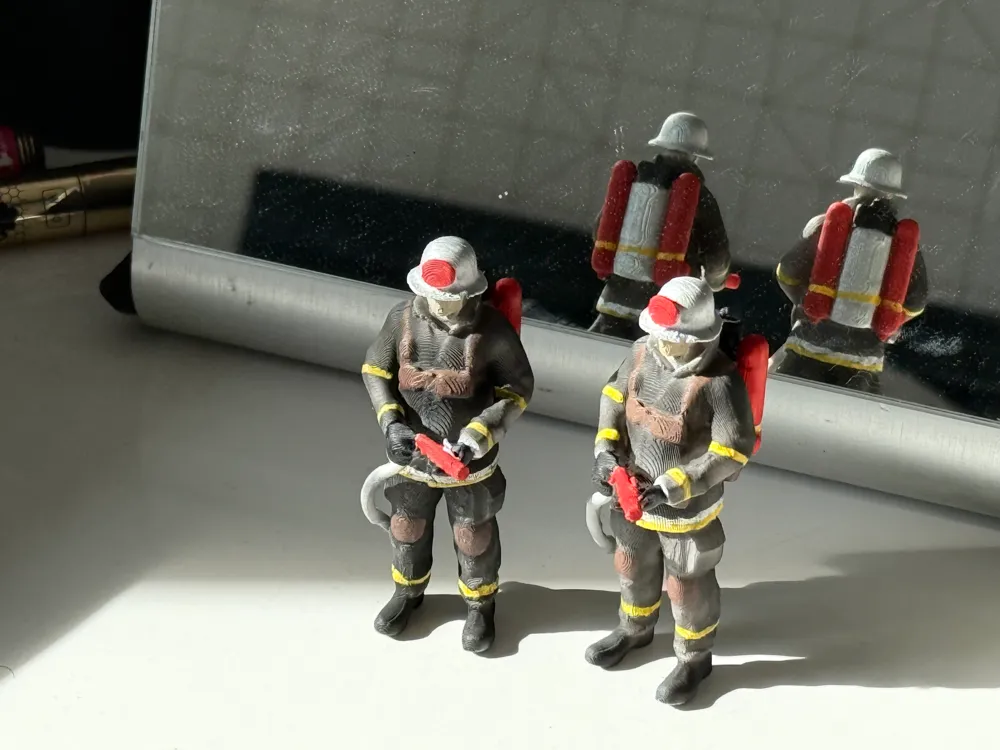 Fireman small figure with firehose by Łukasz - MakerWorld