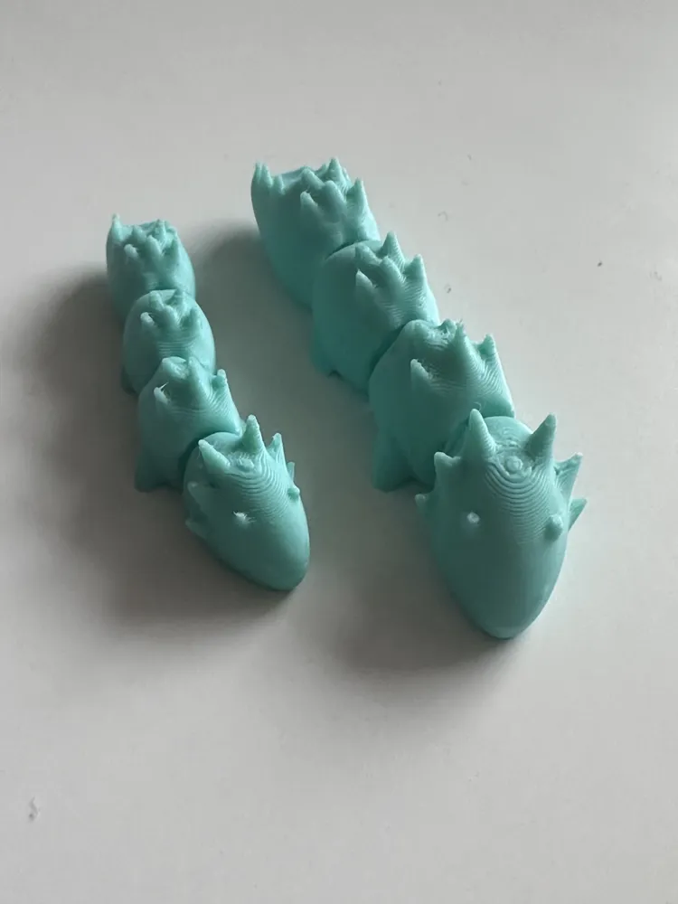 Mini Articulated Ice Dragon - Free 3D Print Model - MakerWorld