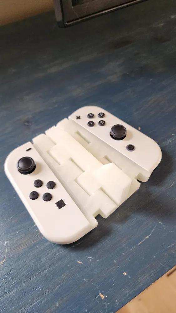 Print in Place Folding Joycon Controller by MooreFORGE MakerWorld ...